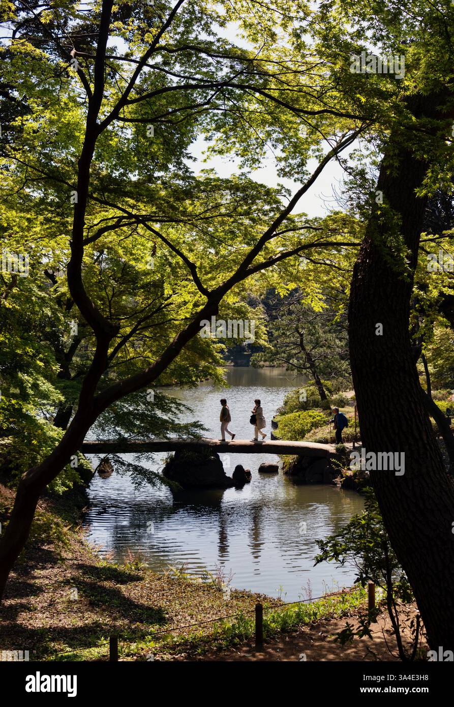 Two visitors take a stroll through the grounds of Rikugien in the Komagome district of Tokyo ...