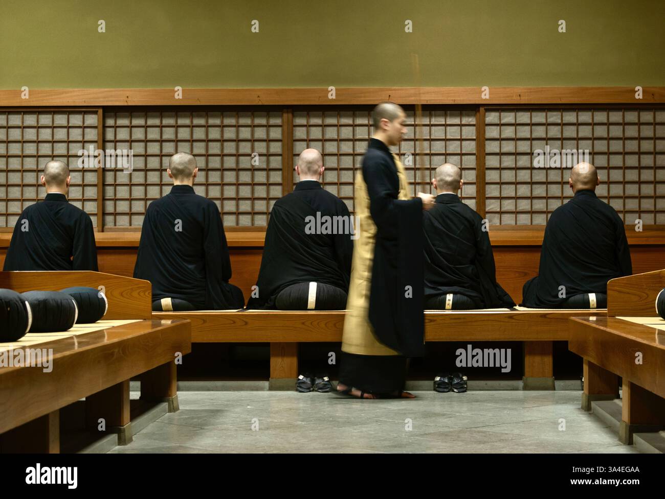 Photo shows priests training in zazen meditation inside the Sodo, or ...