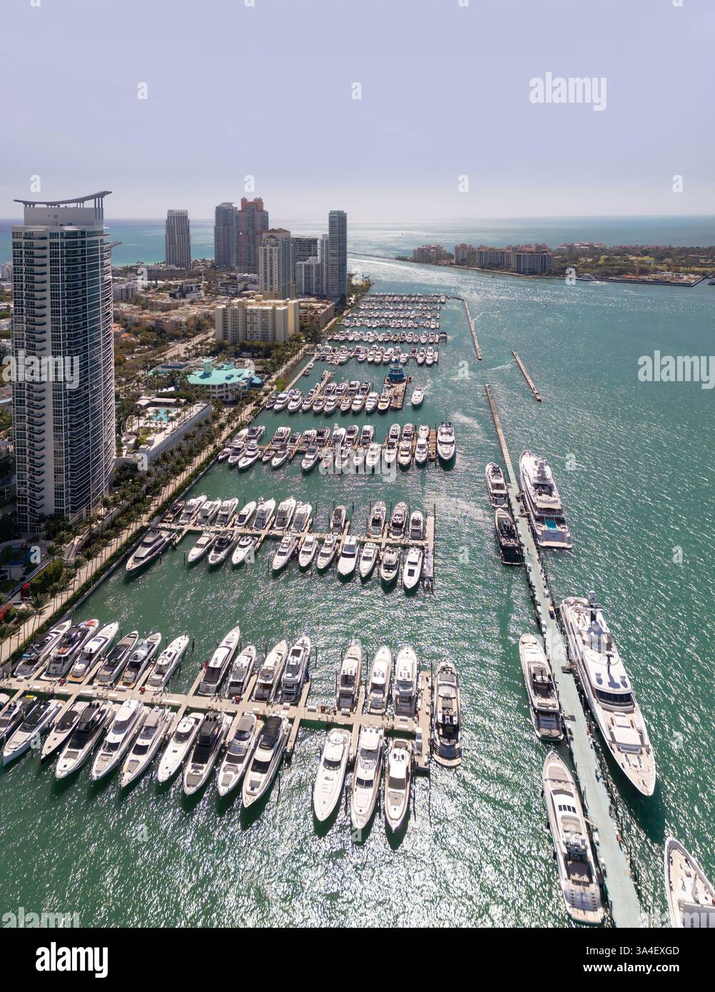 Luxury yacht cruising on Miamis coastline. Aerial view of yachts docked ...