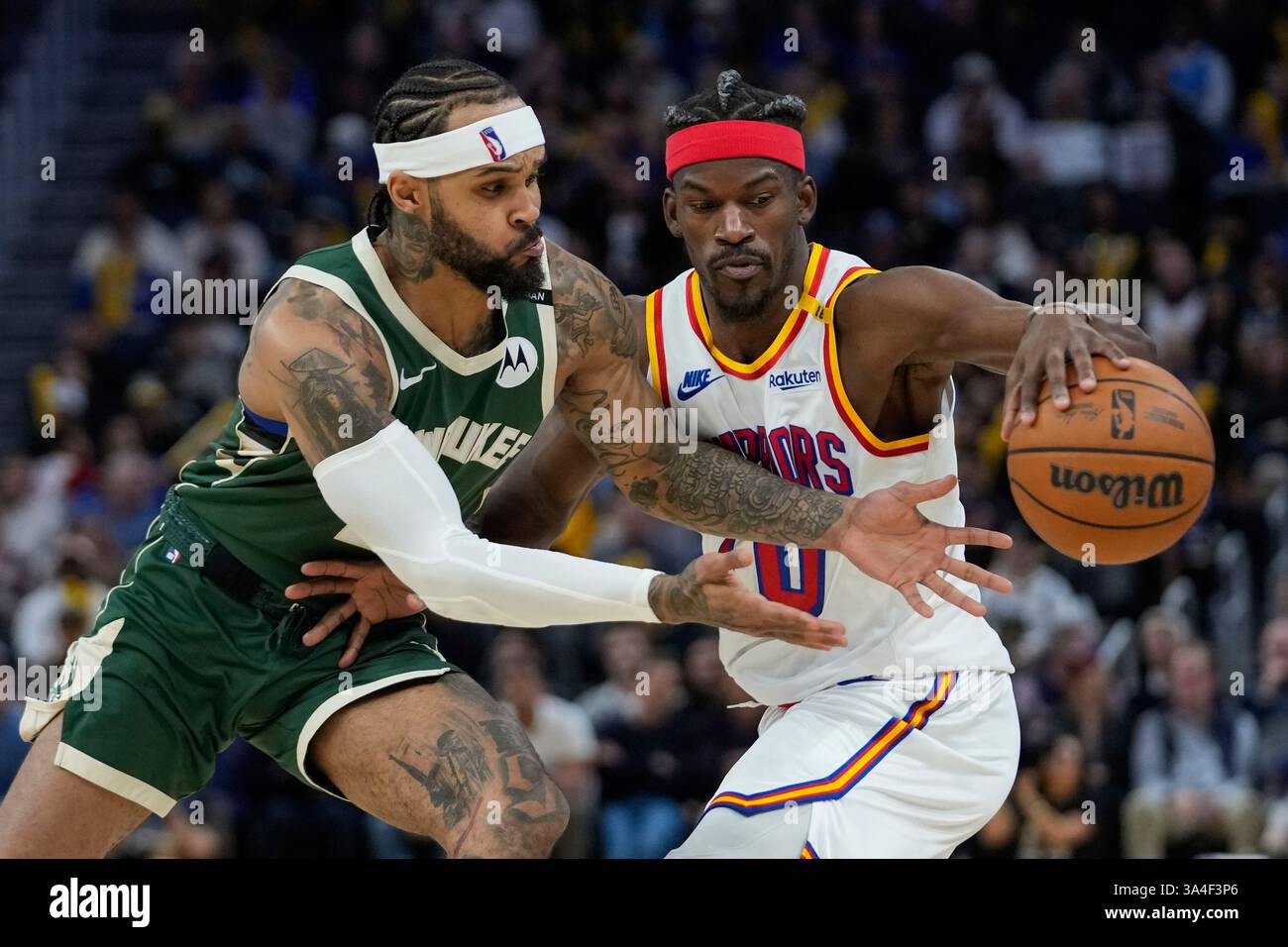 Milwaukee Bucks guard Gary Trent Jr., left, tries to take the ball away ...