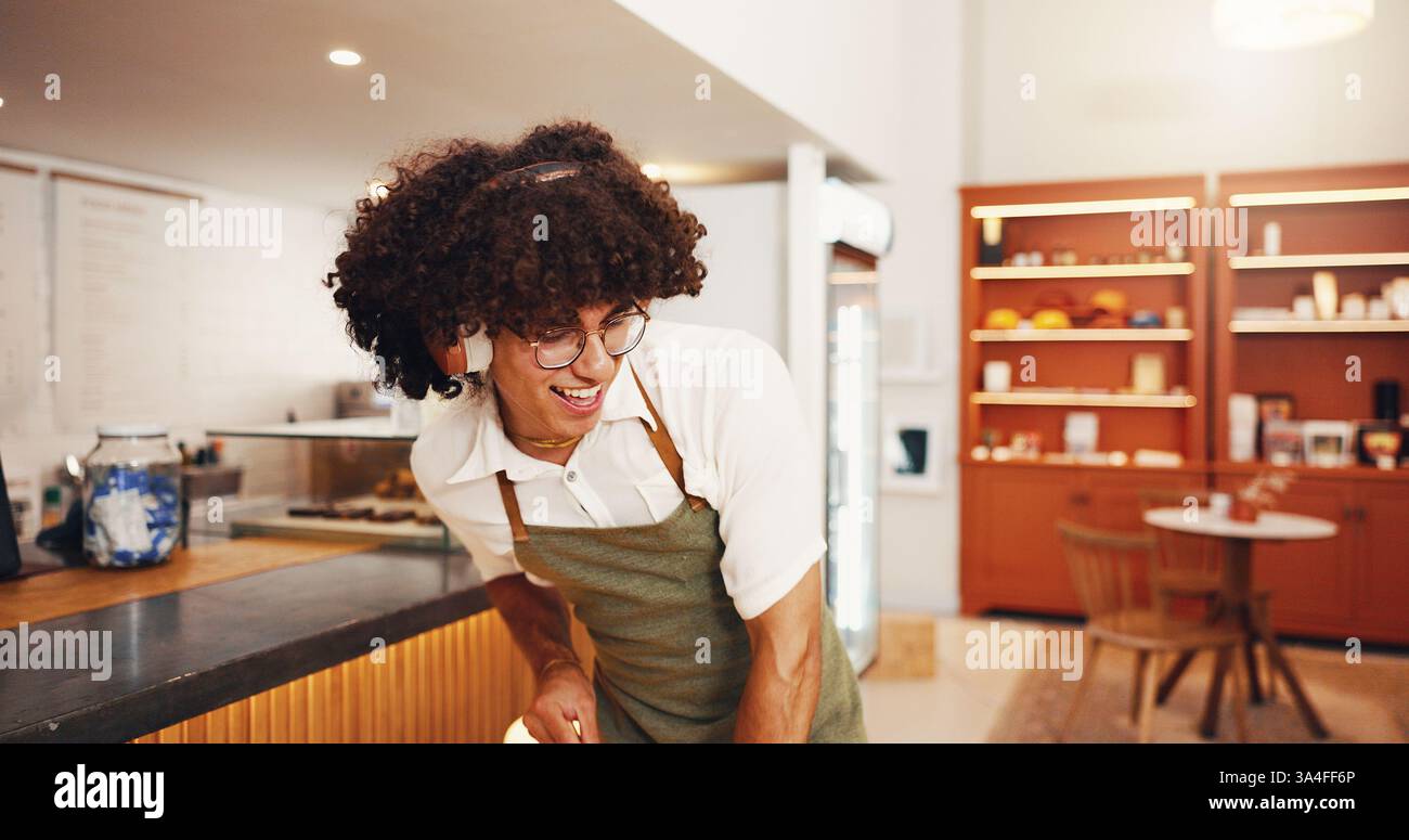 Music, man and barista dance in cafe with energy, radio and streaming ...