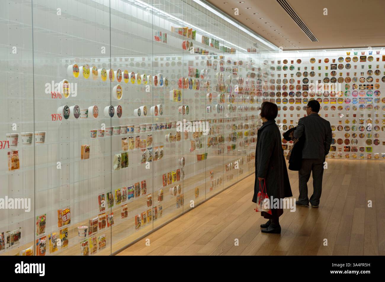 Visitors viewing the product display walls inside the Instant Noodles ...