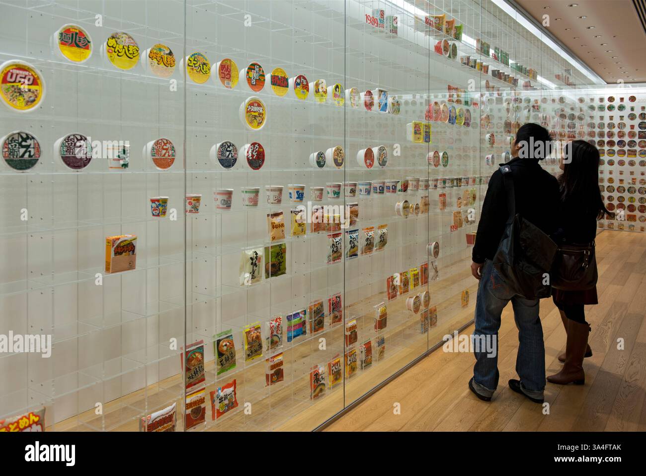 Visitors viewing the product display walls inside the Instant Noodles ...