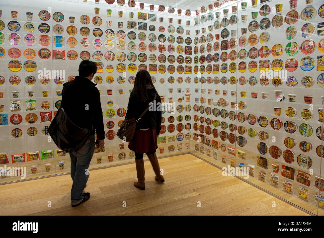 Visitors viewing the product display walls inside the Instant Noodles ...