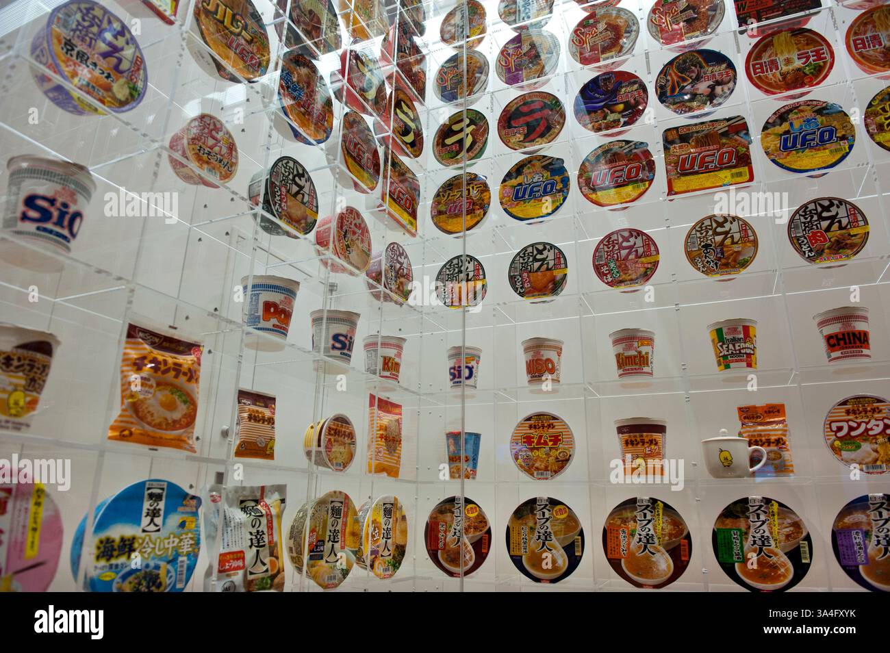 Variety of noodle soup products on display wall in the Instant Noodles ...