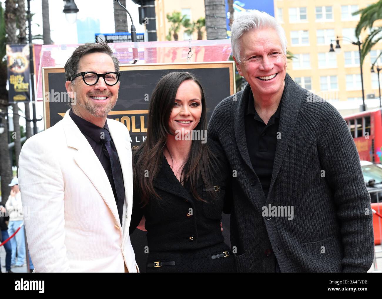 Actor Dan Bucatinsky, honoree Christina Ricci and Writer Don Roos pose in front of her Star On ...
