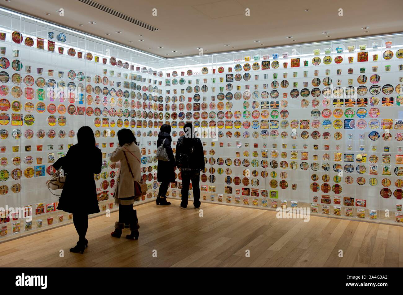 Visitors viewing the product display walls inside the Instant Noodles ...