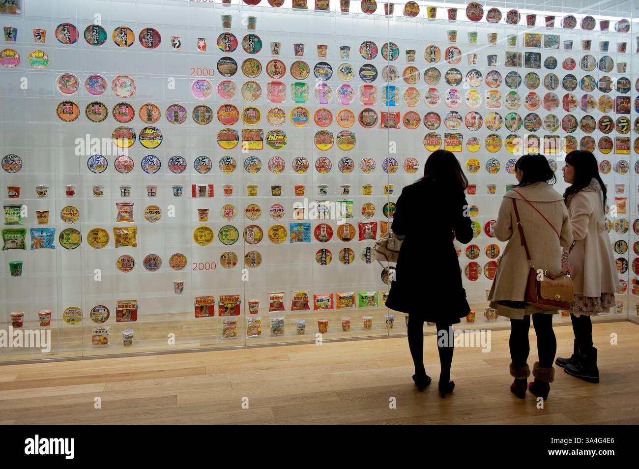 Visitors viewing the product display walls inside the Instant Noodles ...