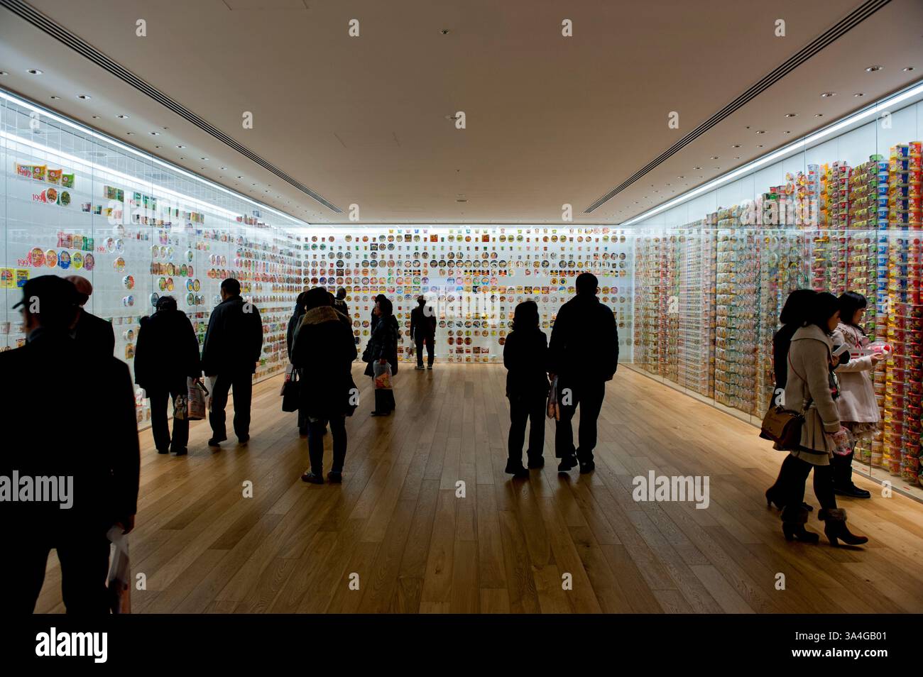 Visitors viewing the product display walls inside the Instant Noodles ...