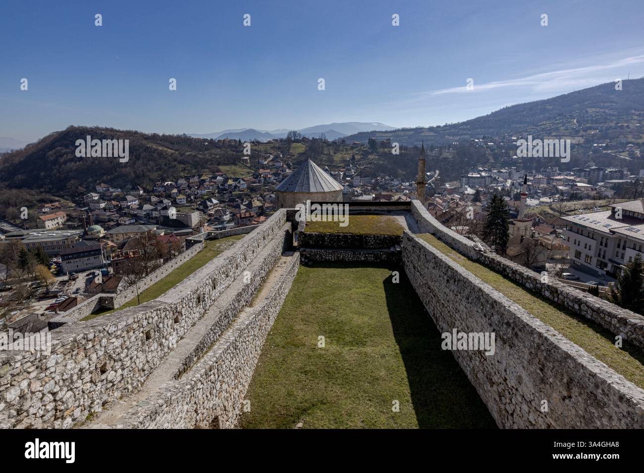 A beautiful view over the rooftops of Travnik in Bosnia, with homes and ...