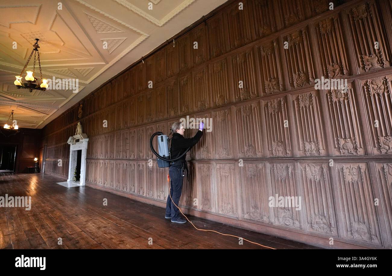 Staff clean panels following conservation work to safeguard the future ...