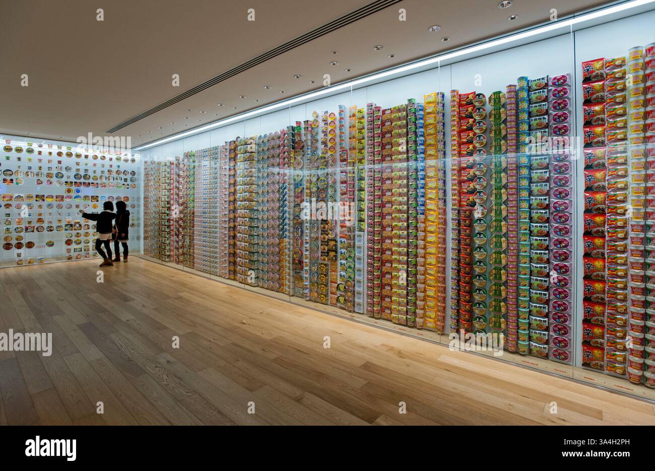 Visitors viewing the product display walls inside the Instant Noodles ...
