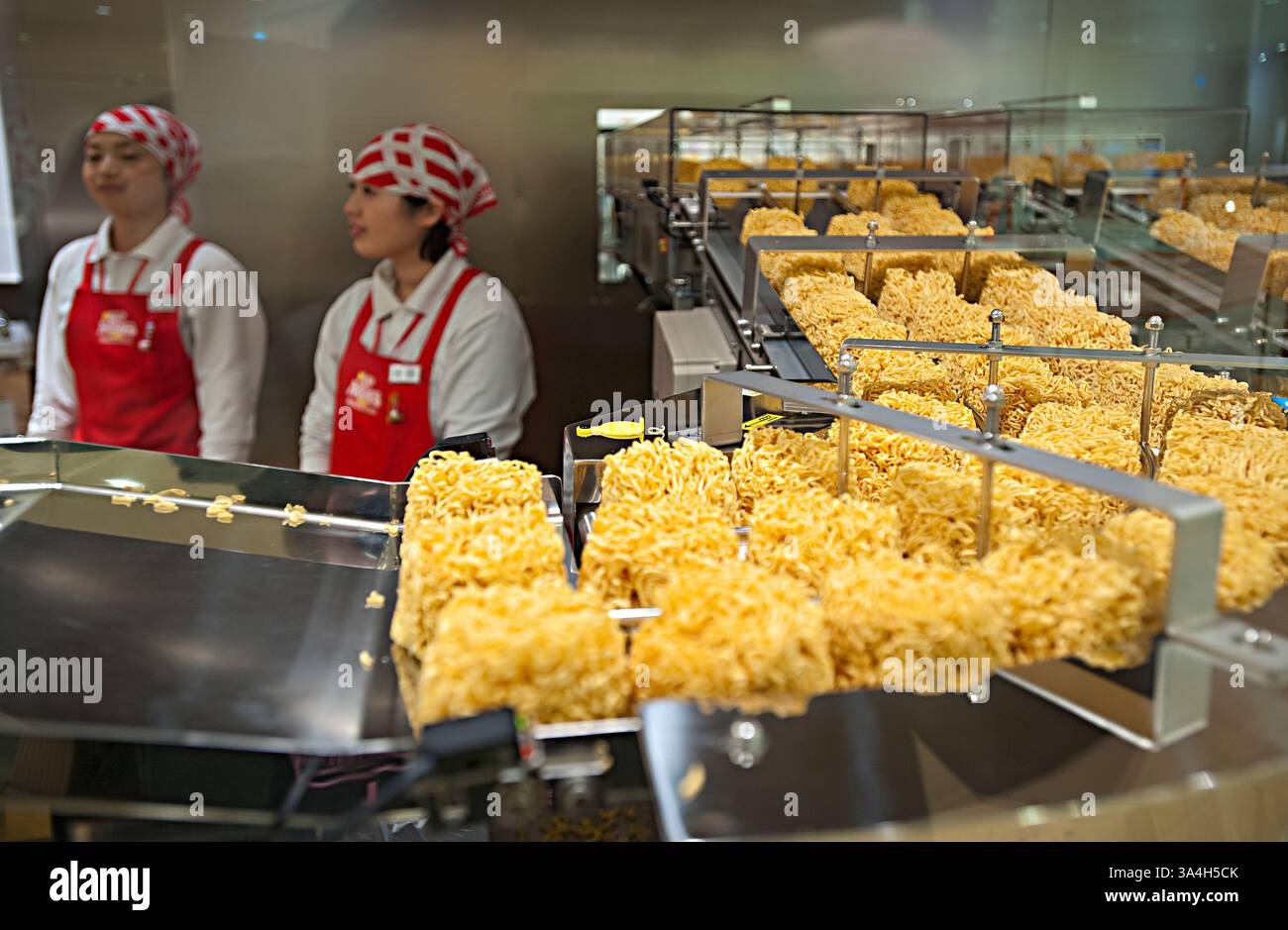 Workers making custom cup noodles to order at the My Cup Noodles ...