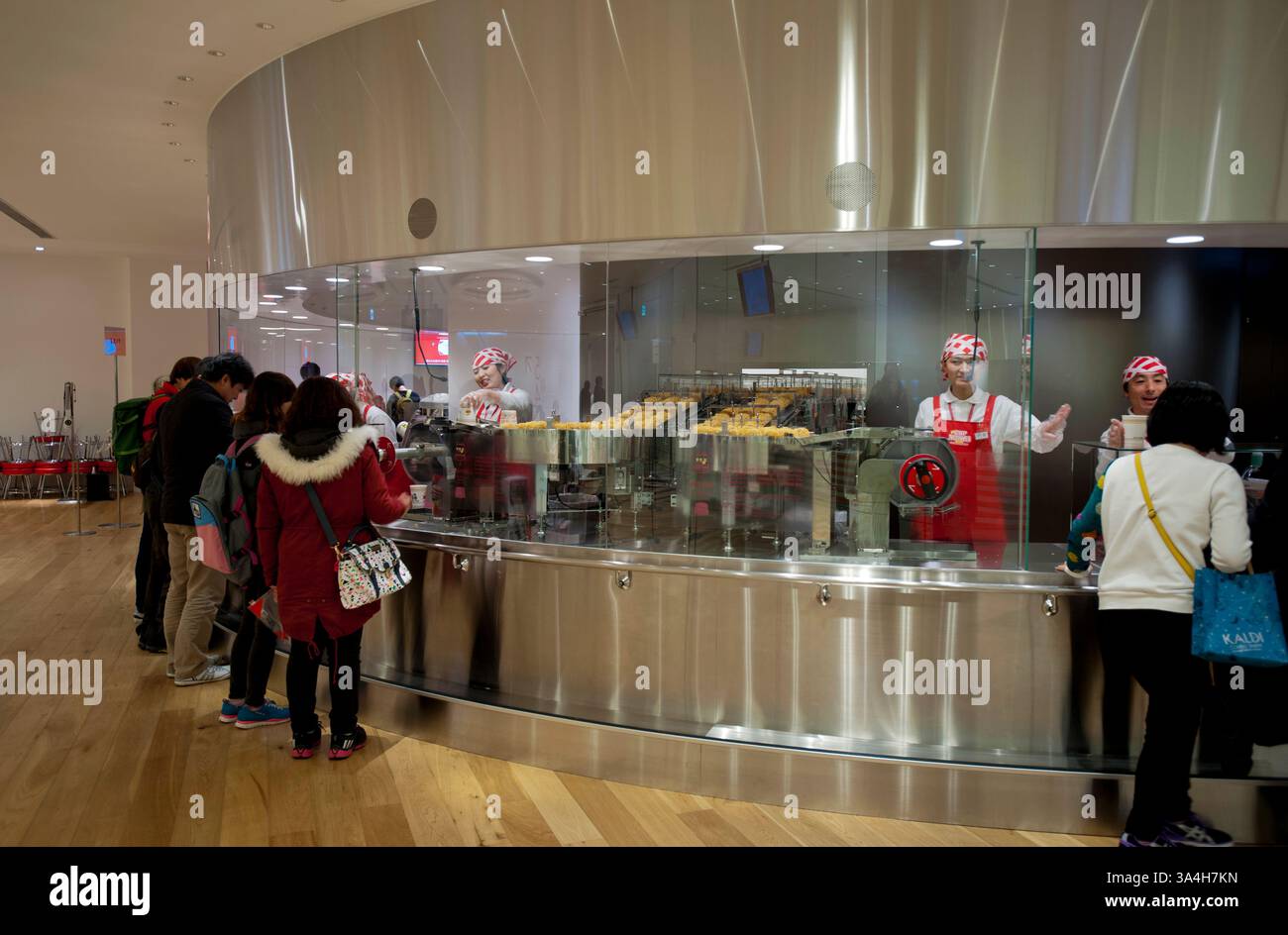 Workers making custom cup noodles to order at the My Cup Noodles ...