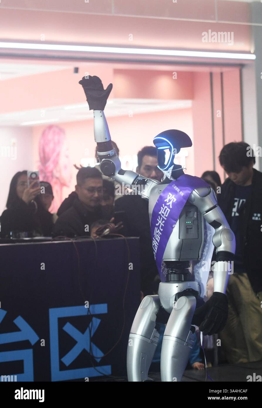 A humanoid robot performs in a shopping mall in Hangzhou City, east ...