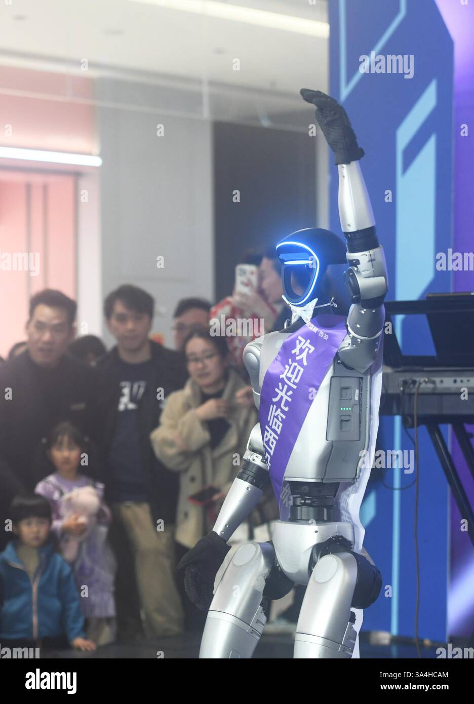 A humanoid robot performs in a shopping mall in Hangzhou City, east ...
