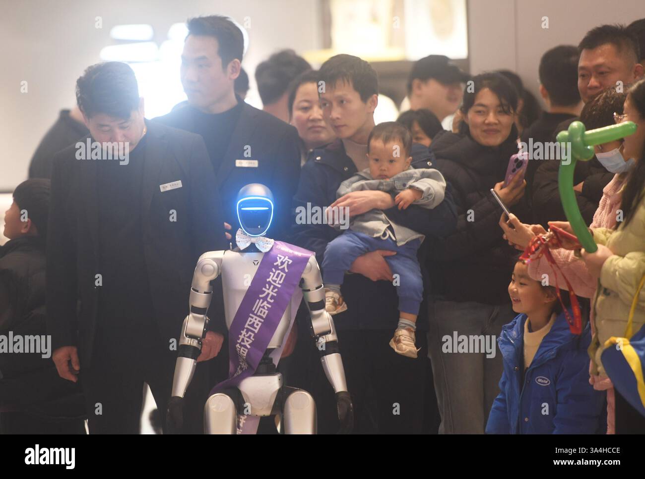 A humanoid robot performs in a shopping mall in Hangzhou City, east ...