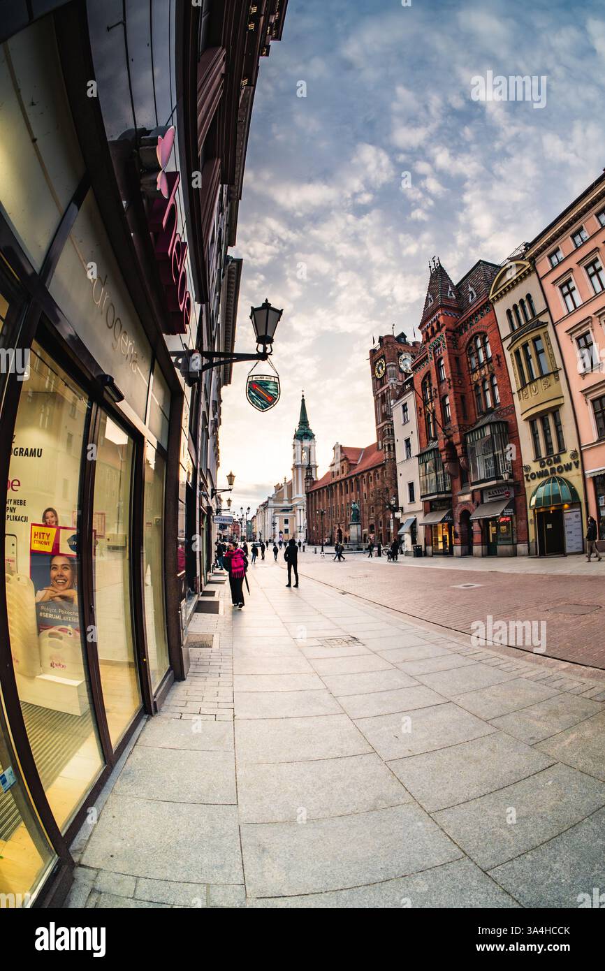 Walking down Szeroka street, visitors enjoy the vibrant architecture ...