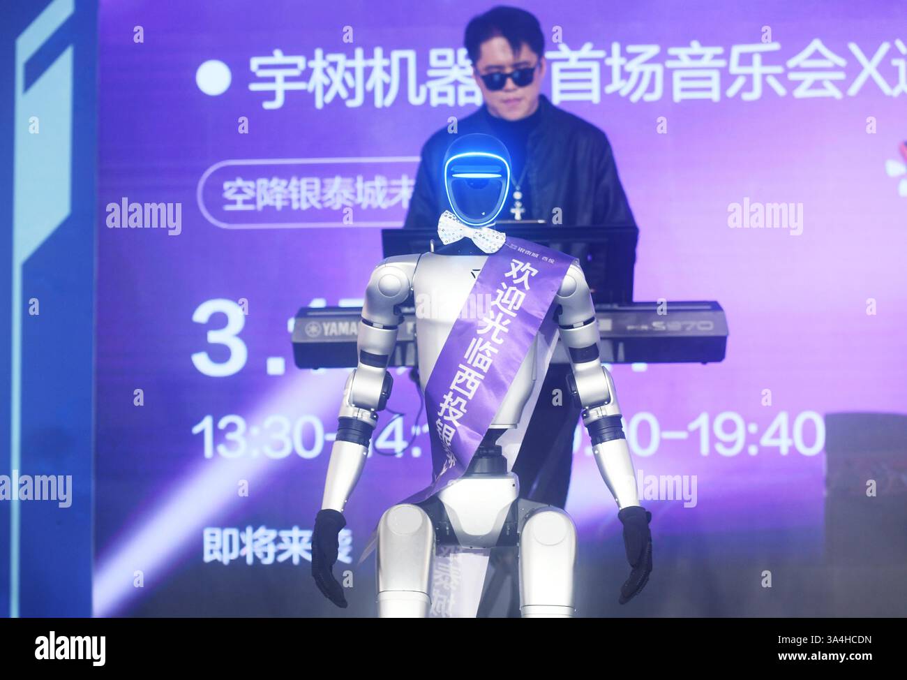 A humanoid robot performs in a shopping mall in Hangzhou City, east ...