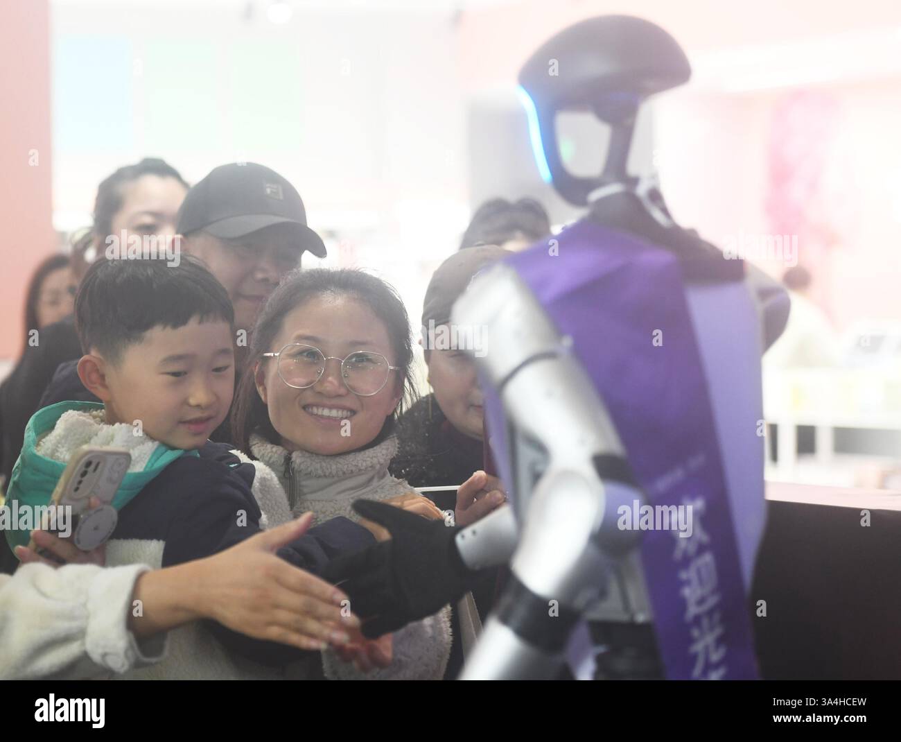 A humanoid robot performs in a shopping mall in Hangzhou City, east ...