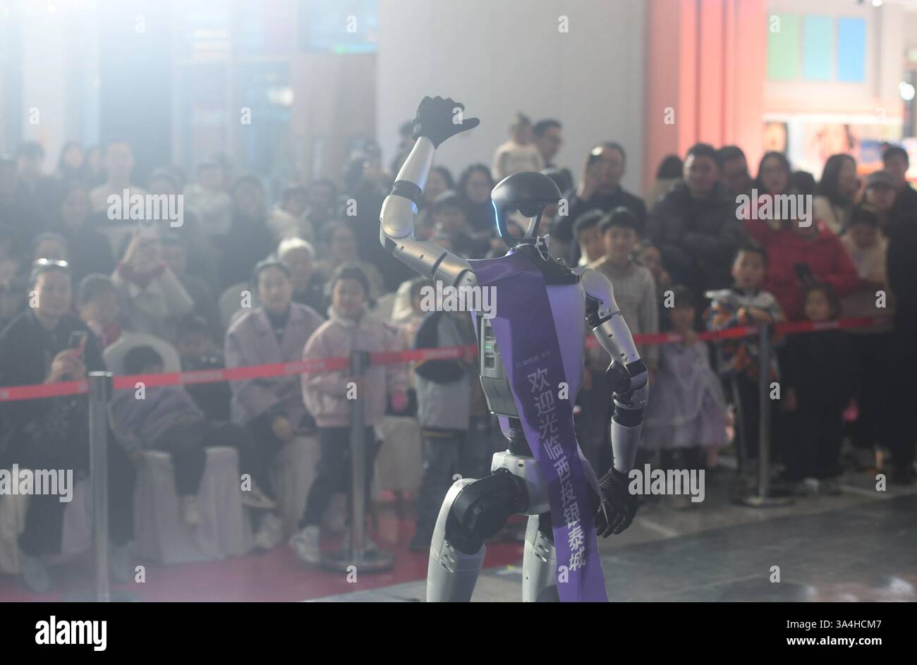 A humanoid robot performs in a shopping mall in Hangzhou City, east ...
