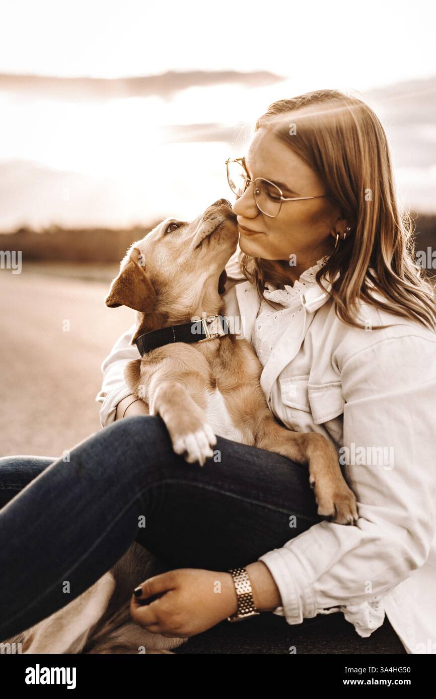 Young woman kissing labrador hi-res stock photography and images - Alamy