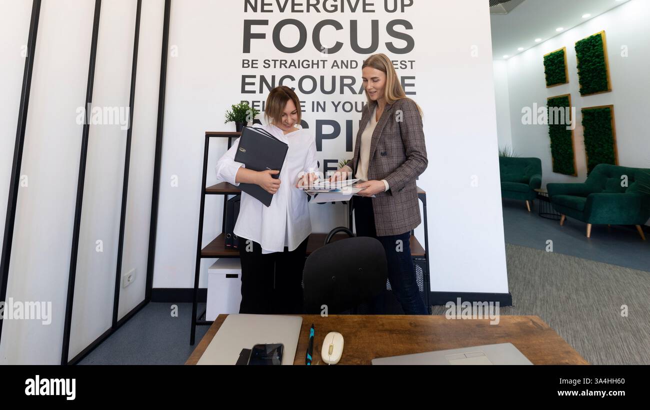 Team members collaborate on a project in a modern office space with ...