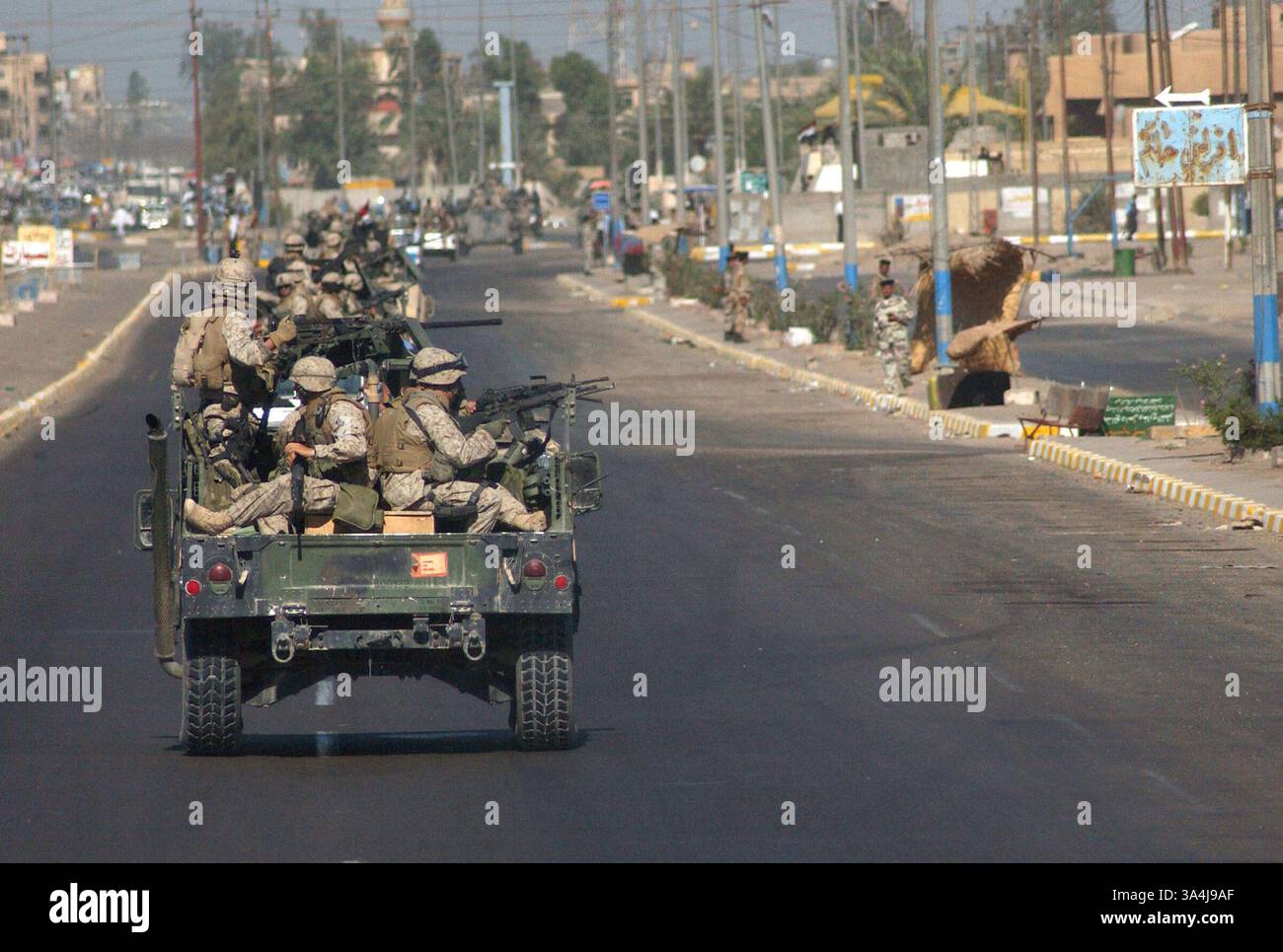 Marines patrol the streets of fallujah hi-res stock photography and ...