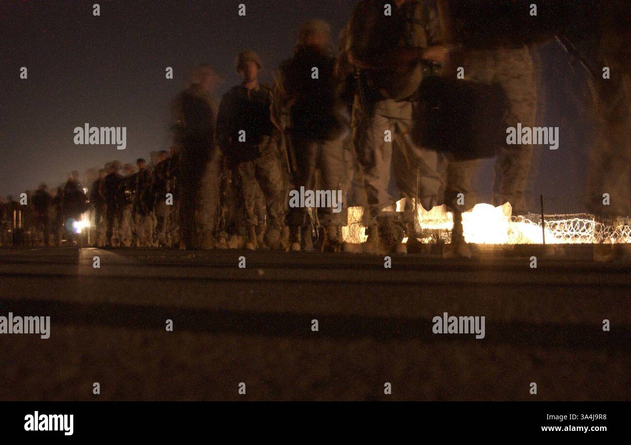Jun 22, 2004; Al Asad, Iraq; Marines from 3rd Marine Aircraft Wing mill ...