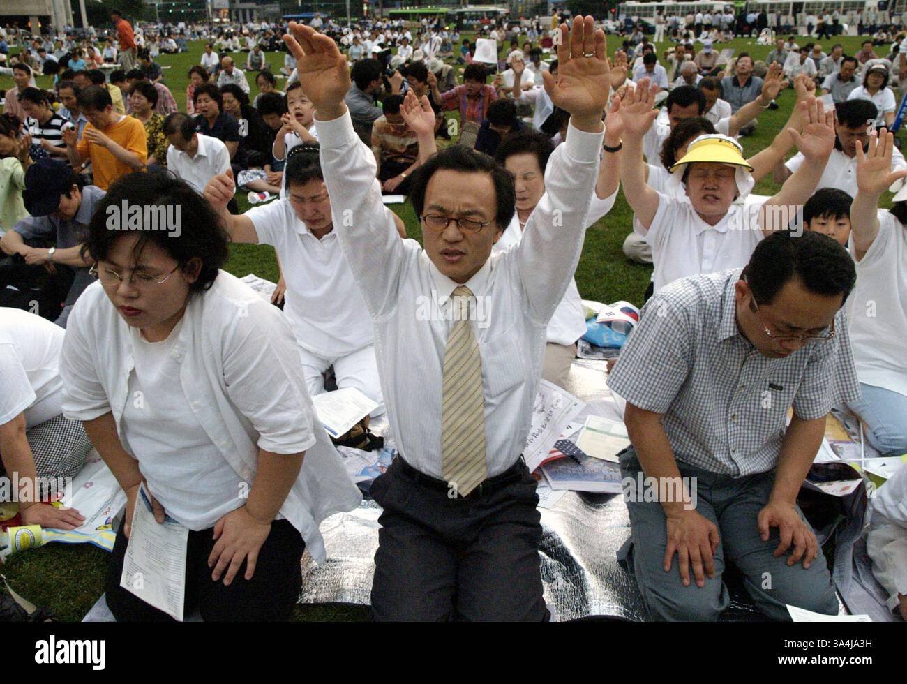 Jun 25, 2004; Seoul, Korea; South Korean Christians pray for peace in the Korean peninsula from ...