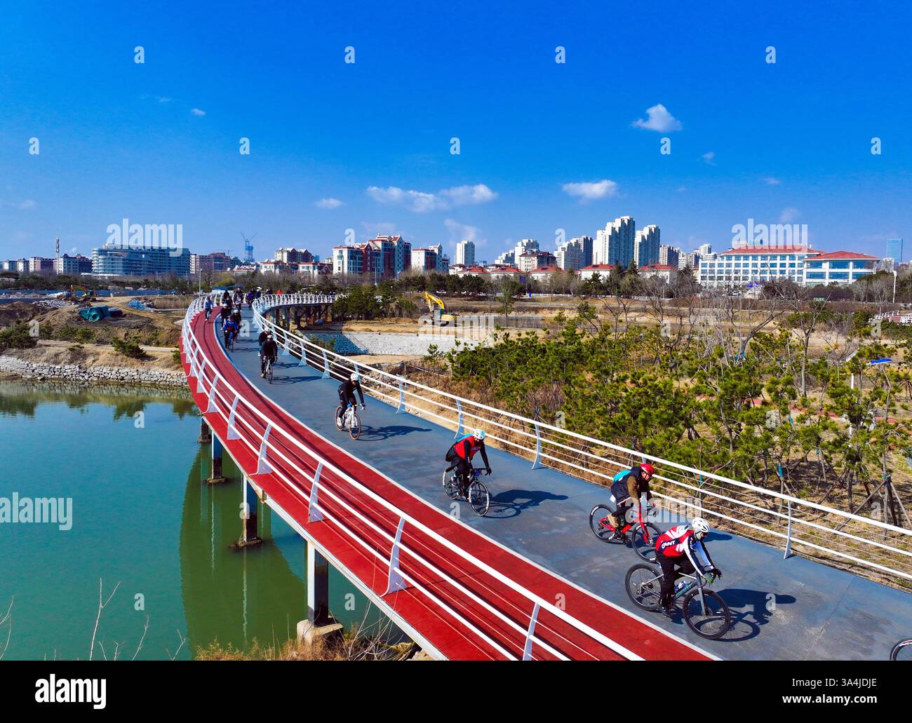 Cycling enthusiasts compete in a cycling race in Rizhao City, east ...