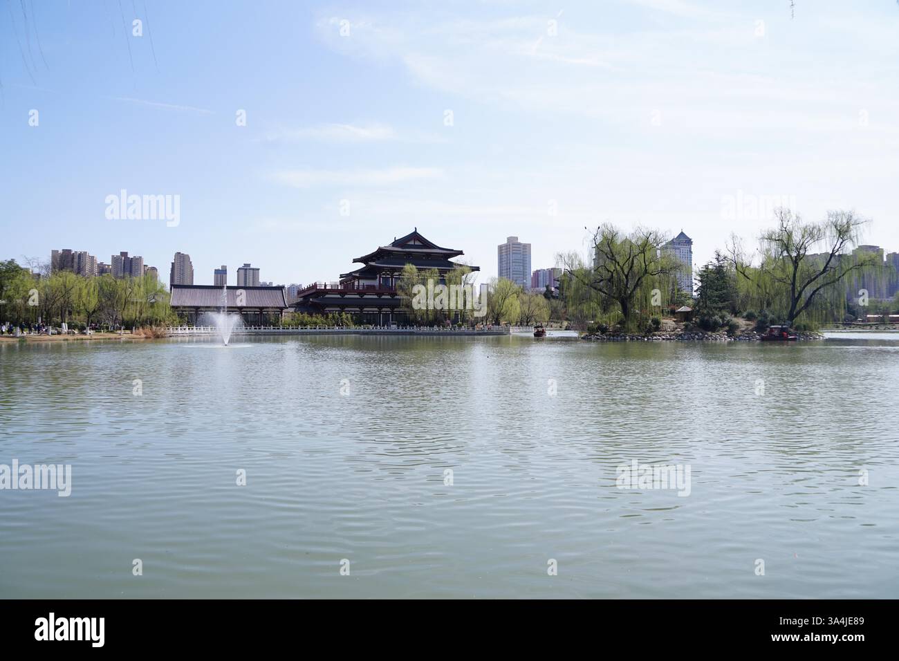 Tourists admire spring scenery at the Xingqinggong Park in Xi'an City ...