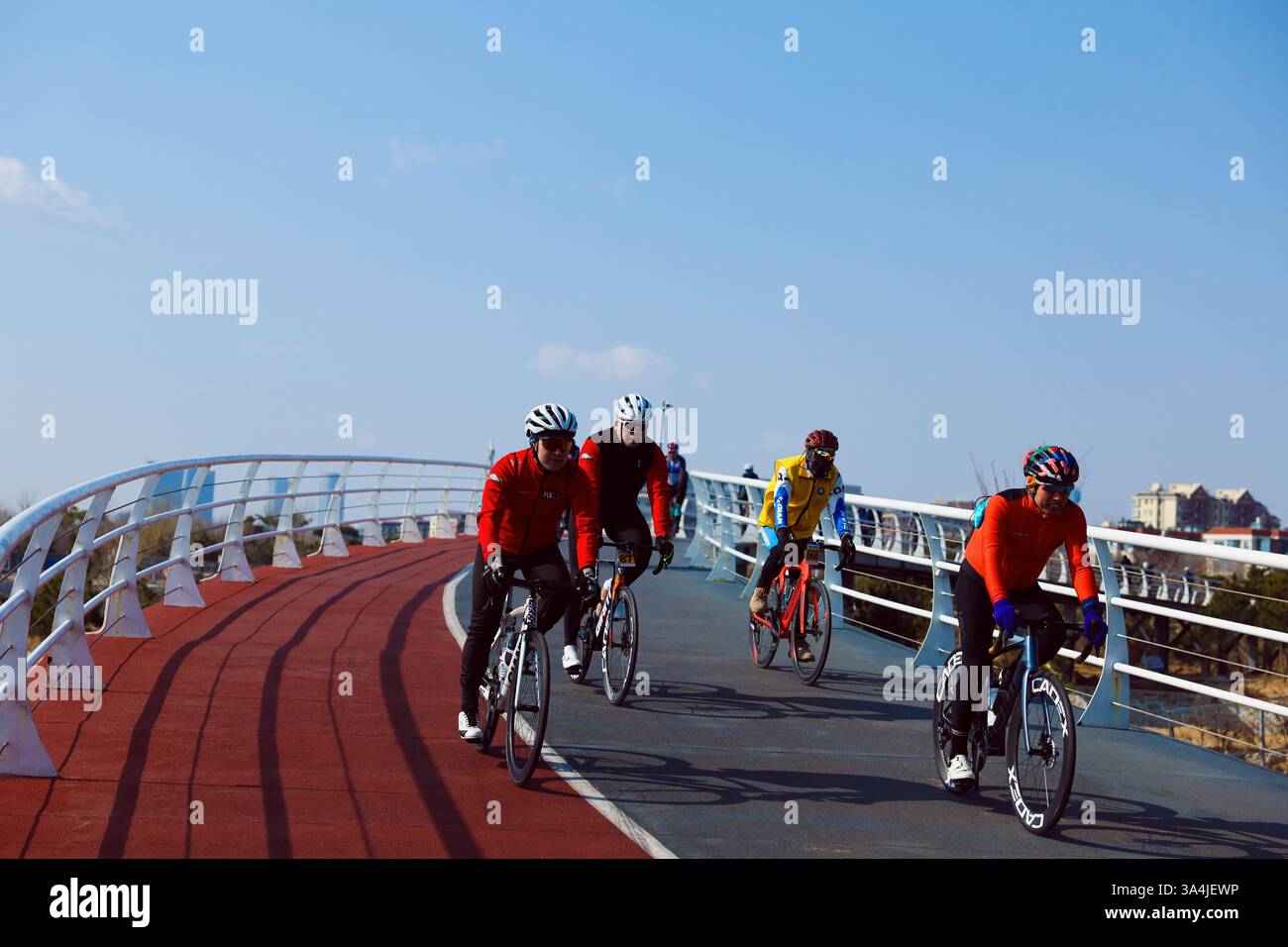 Cycling enthusiasts compete in a cycling race in Rizhao City, east ...