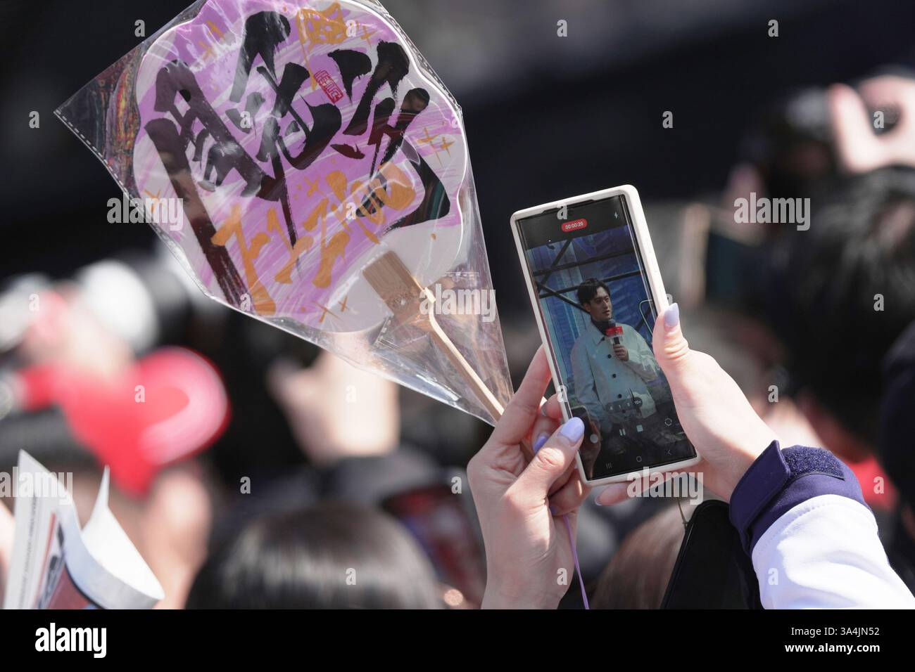 Shanghai,China.18th March 2025. A fan meet-and-greet event for Zhou ...