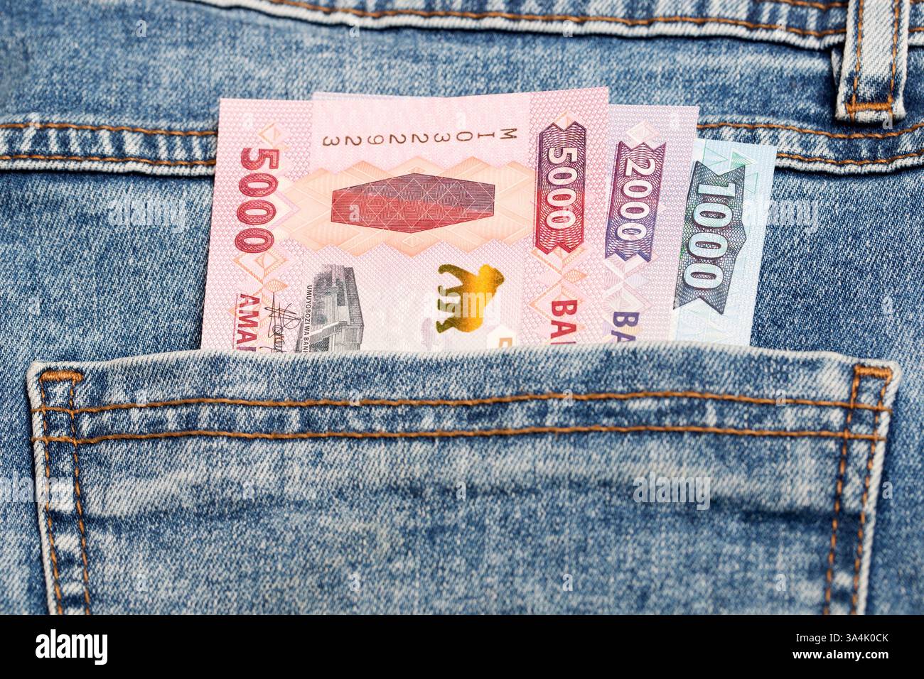 Rwandan money - Franc in the pocket of blue jeans Stock Photo - Alamy