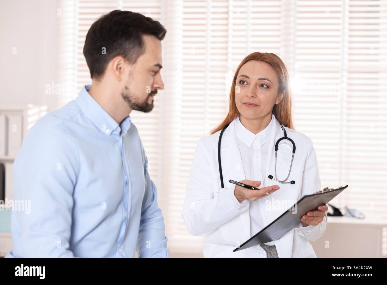 Man having appointment with cardiologist in clinic Stock Photo - Alamy