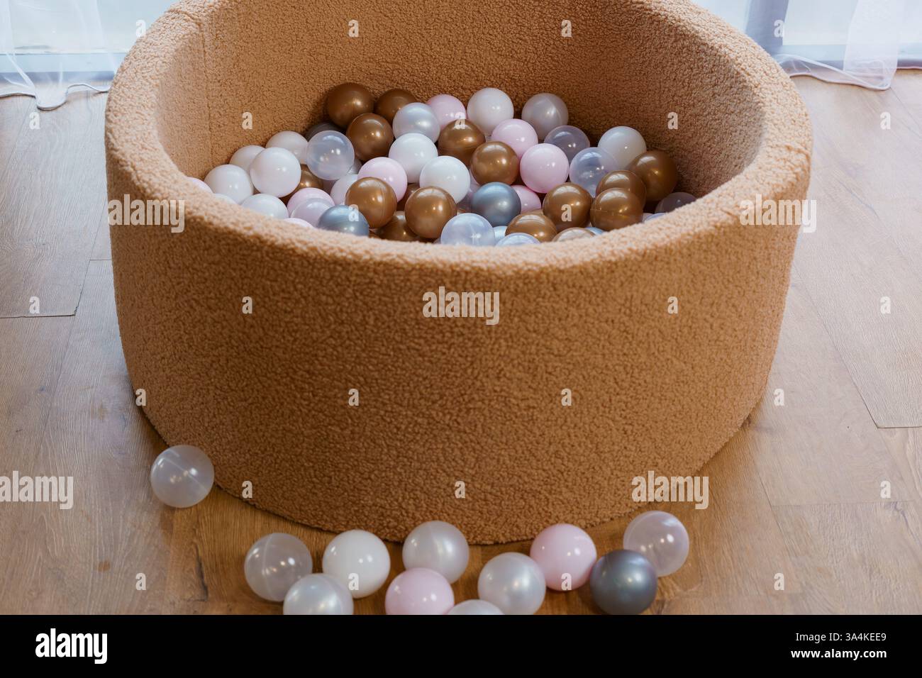 Cozy Kids Ball Pit with Soft Pastel Colored Plastic Balls on Wooden ...