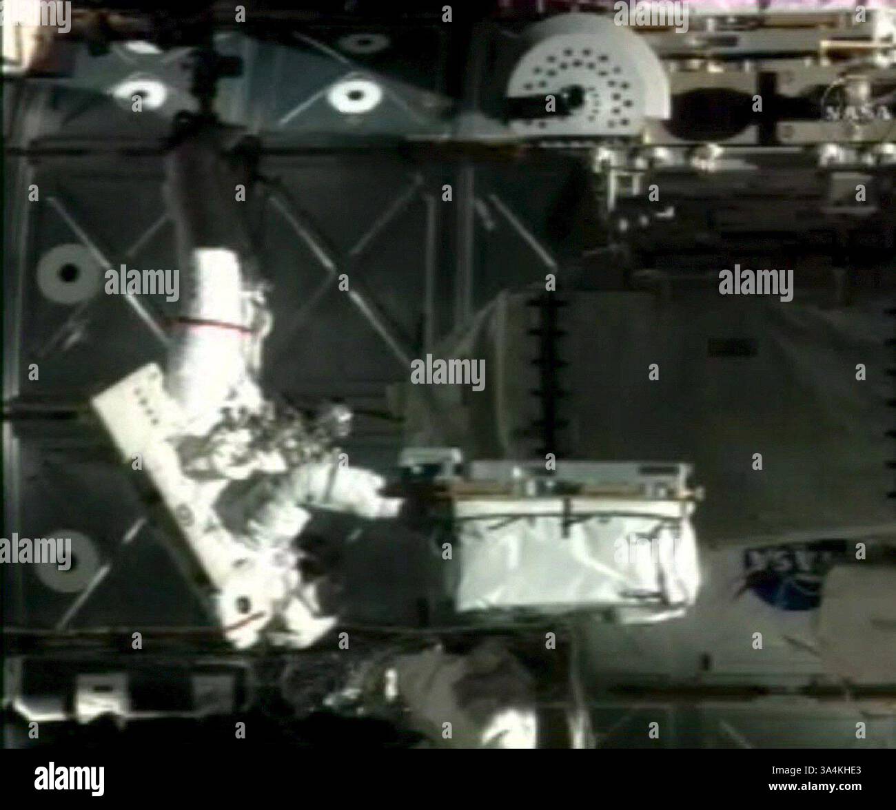 This photo made from NASA TV shows shuttle astronaut Michael Foreman ...