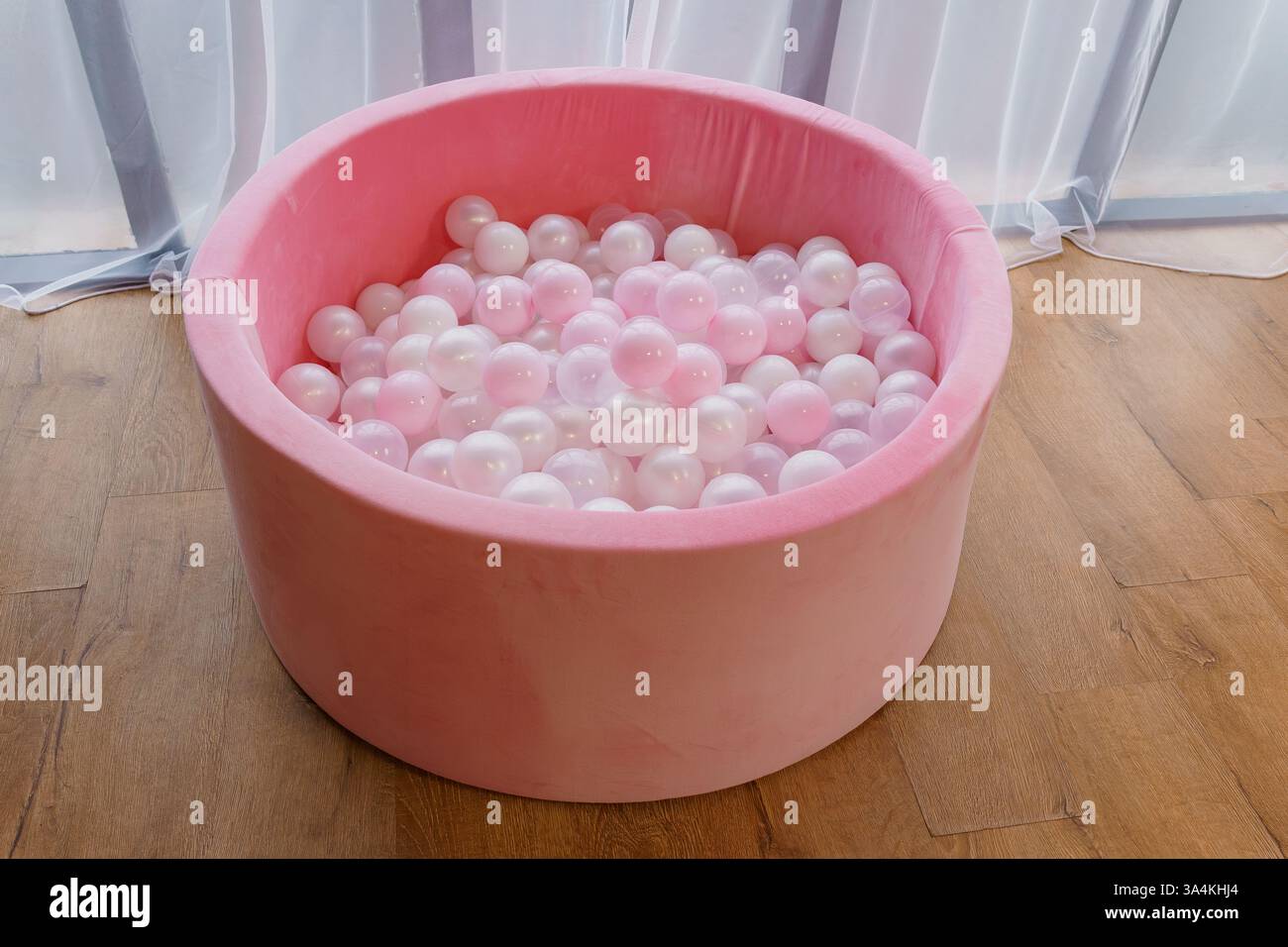 Soft Pink Ball Pit Filled with White and Pink Balls in Cozy Home ...