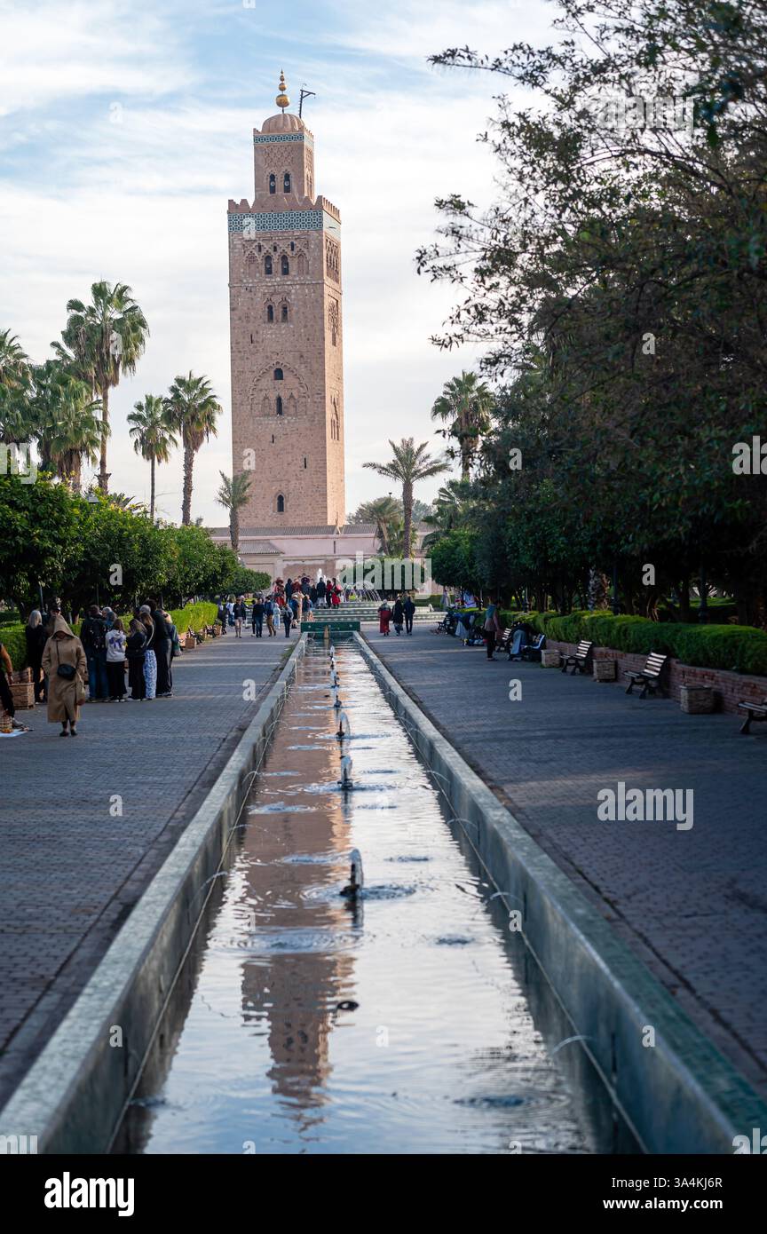 Marrakech, Morocco - February 18, 2025: Visitors stroll along a pathway ...