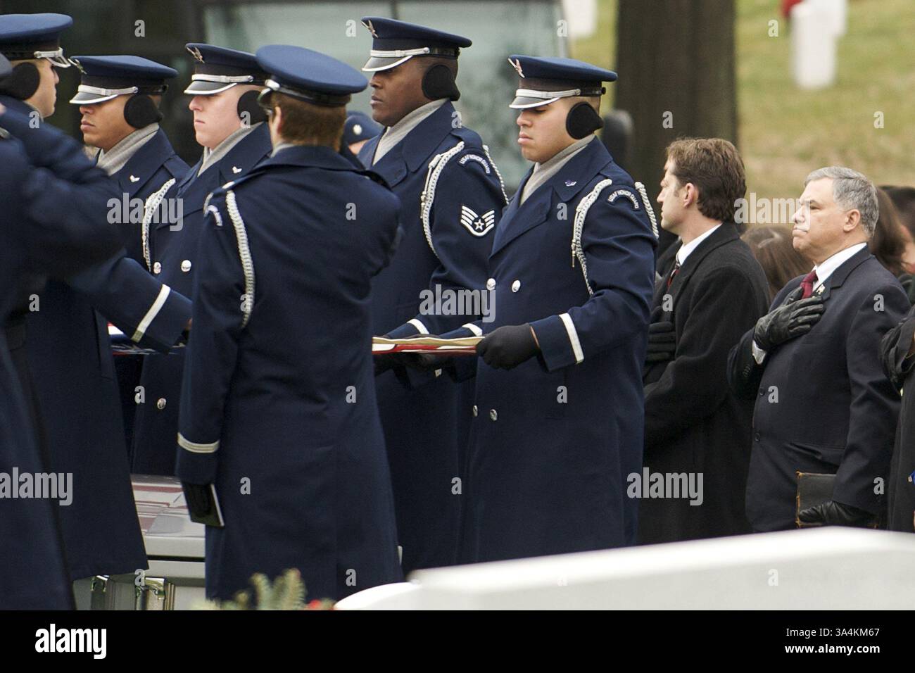 Dec. 18, 2008 - Russell McElroy (far right) stands during the burial ...
