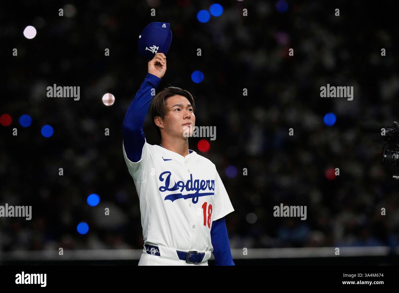 Los Angeles Dodgers' Yoshinobu Yamamoto tips his cap during team ...