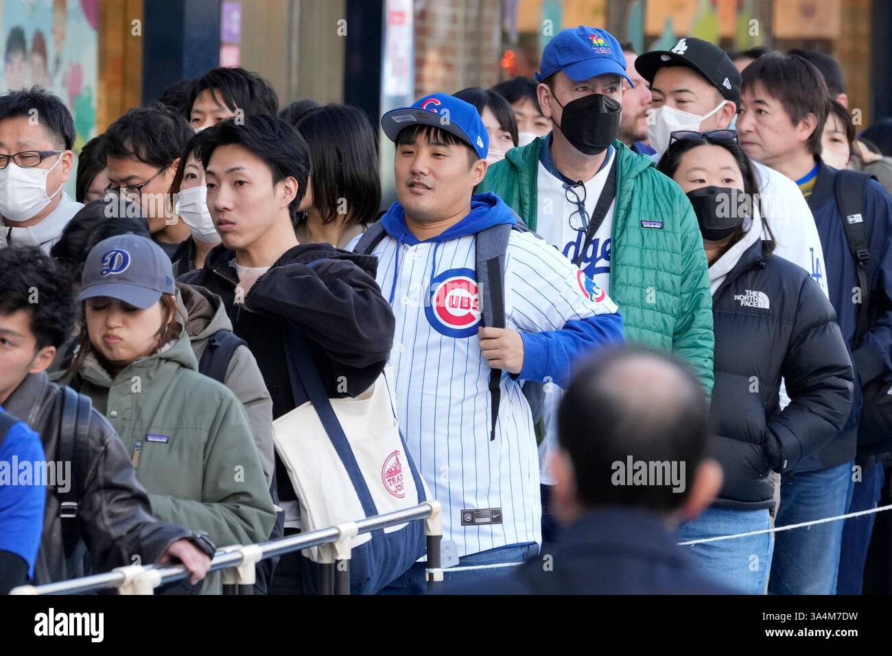 Fans of the Chicago Cubs and the Los Angeles Dodgers walk around the ...