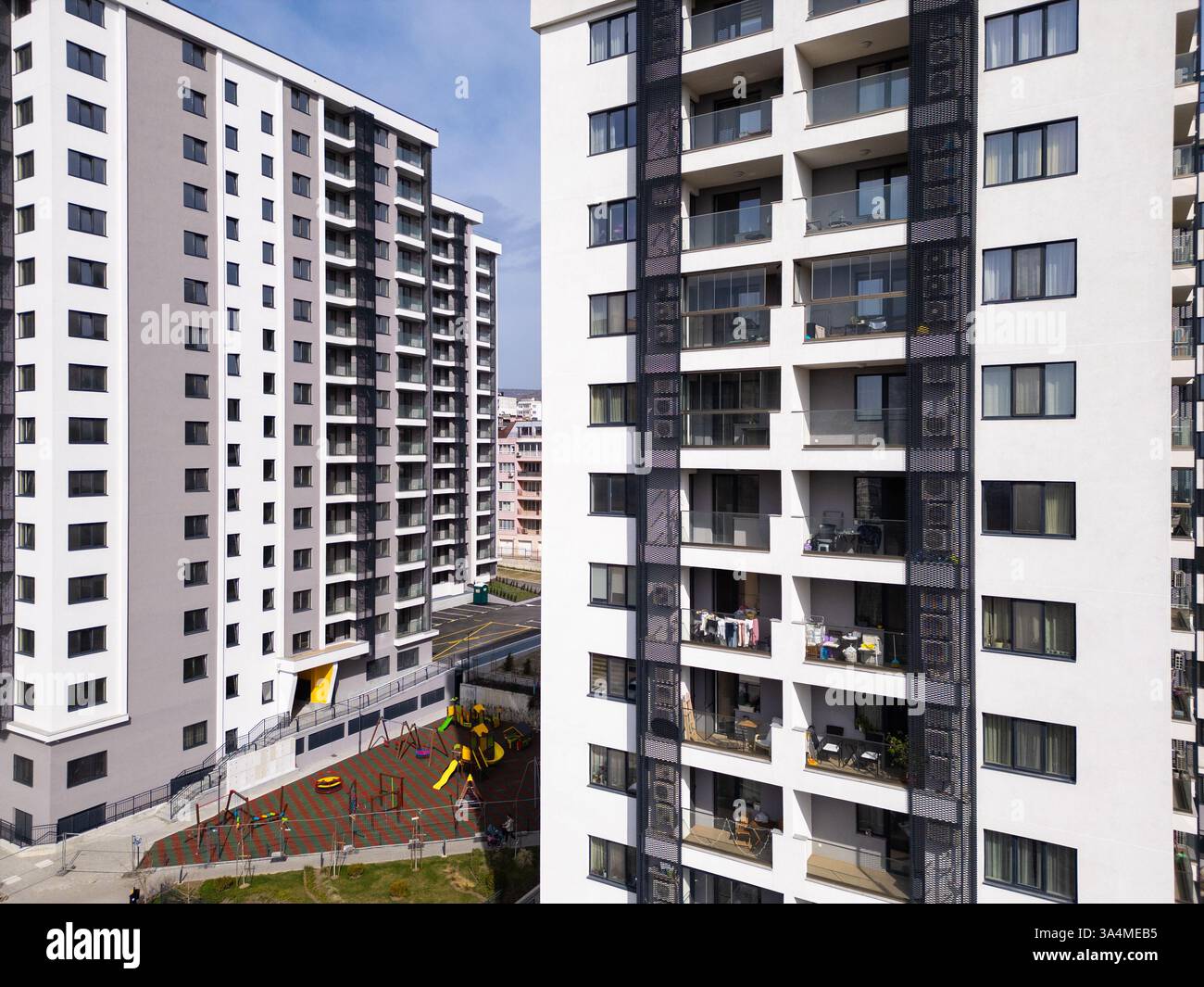 Modern high-rise residential buildings with balconies and large windows ...