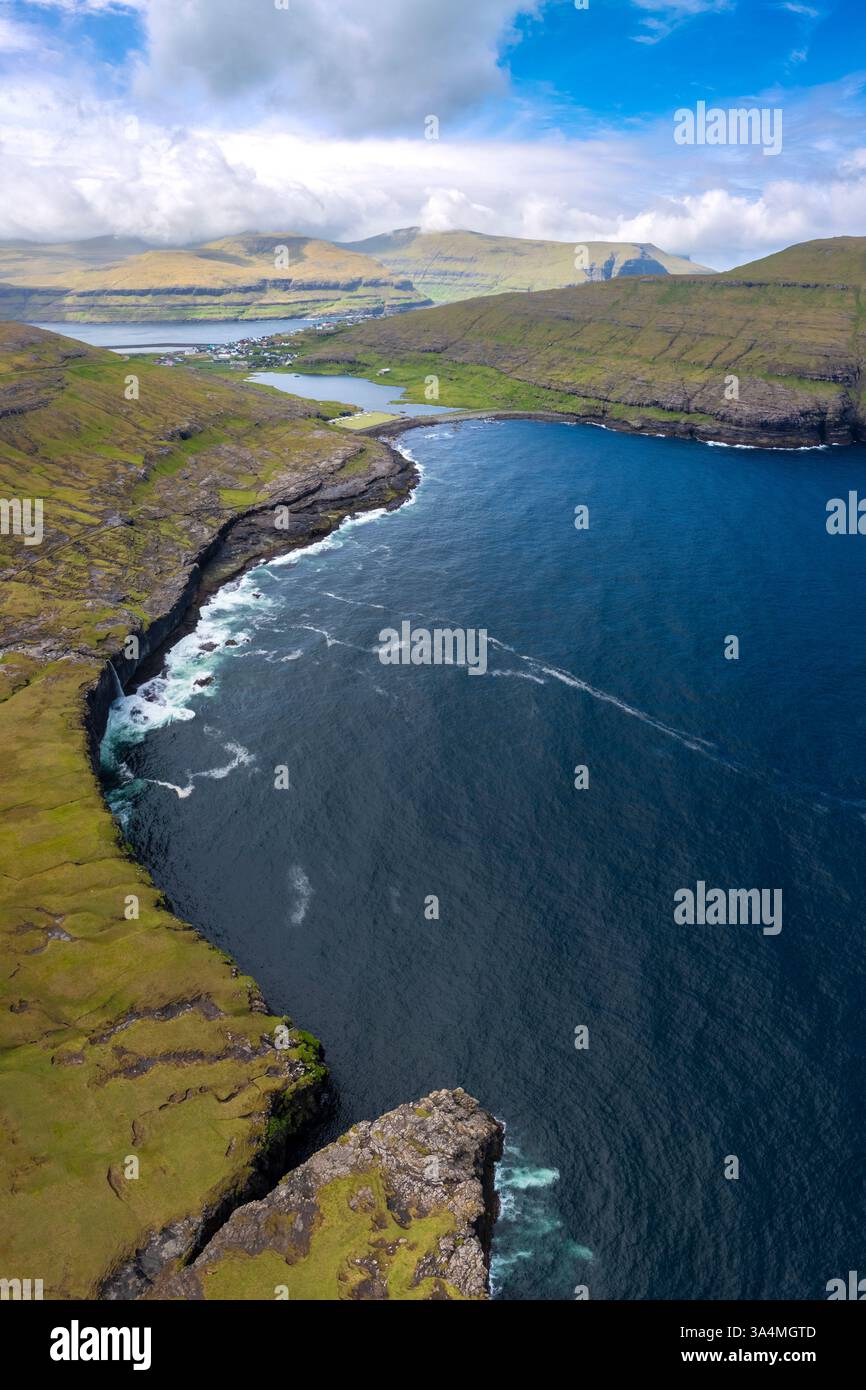 Aerial view of the wild coast near Eidi village. Eysturoy island, Faroe ...