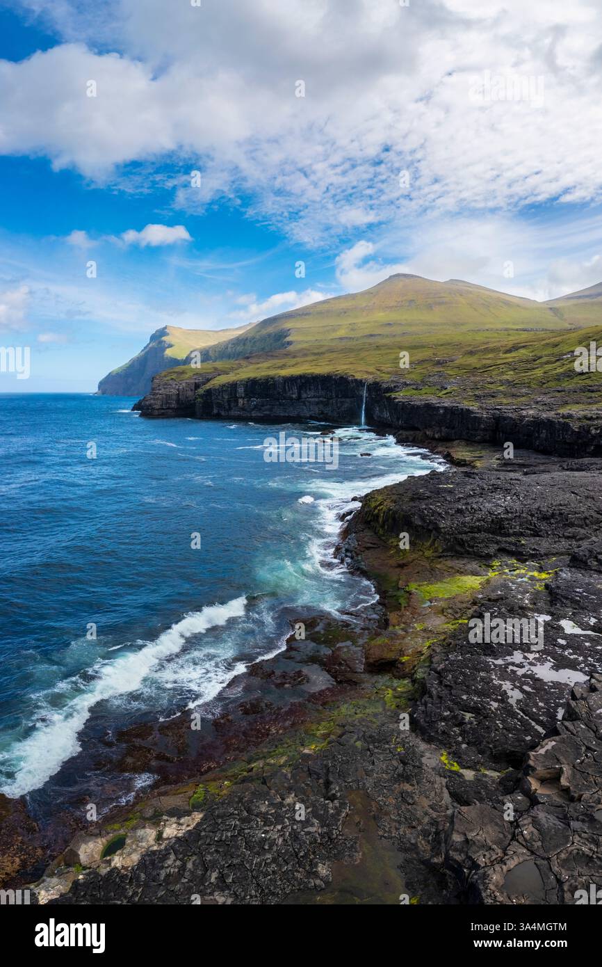 Aerial view of the wild coast near Eidi village. Eysturoy island, Faroe ...
