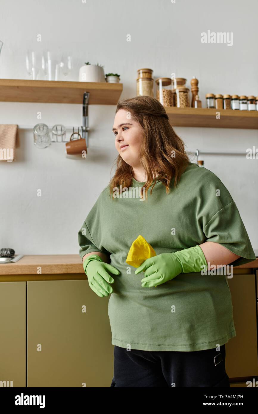 A young pretty woman with Down syndrome enjoys a cozy moment at home ...