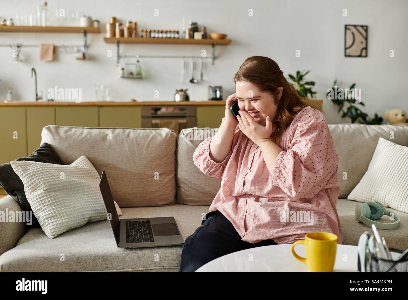 Cozy atmosphere as a young woman with Down syndrome shares smiles ...