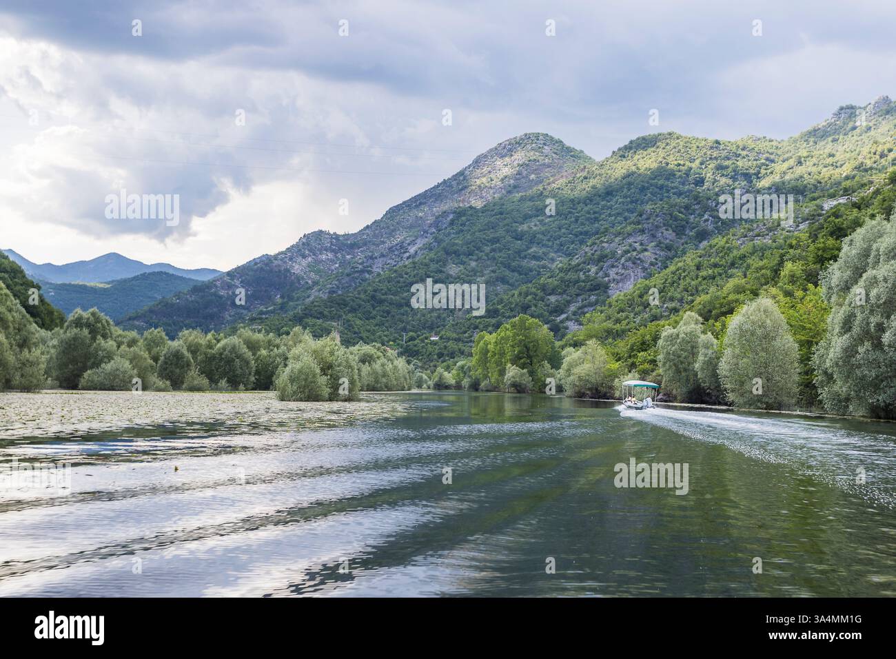 Boats exit Lake Skadar Stock Photo - Alamy