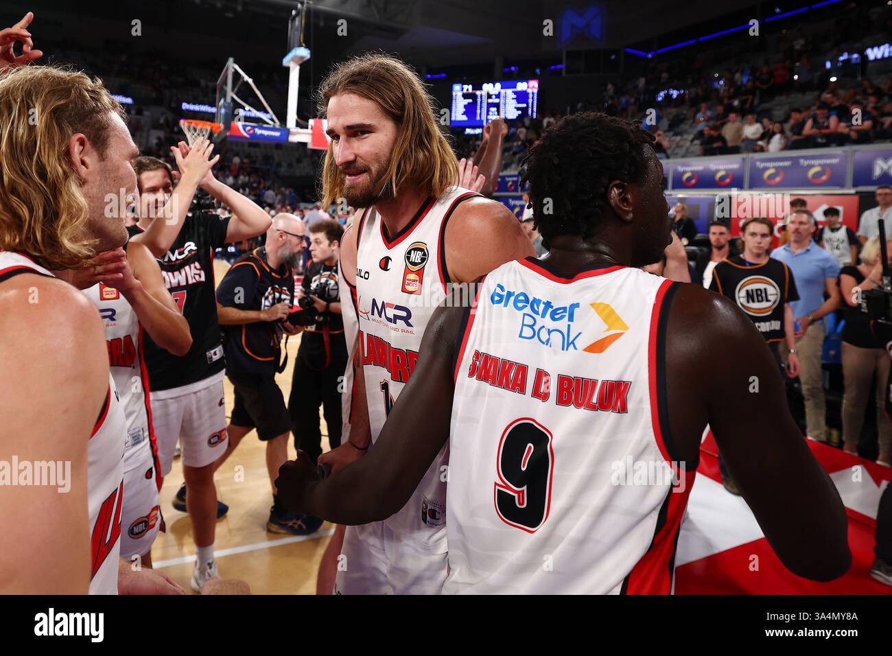 Hawks players and staff members rally around Sam Froling of the ...